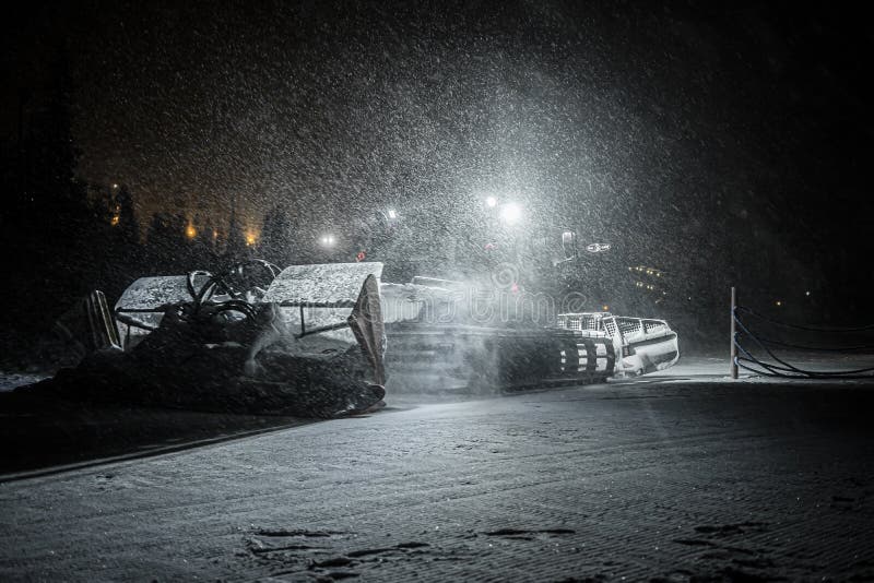 Snowcat Preparing a Slope at Night Stock Photo - Image of snowplow ...