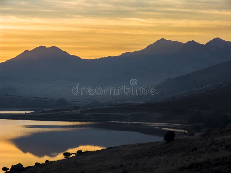Snowdon Horseshoe in the Sunset Stock Photo - Image of reflected ...