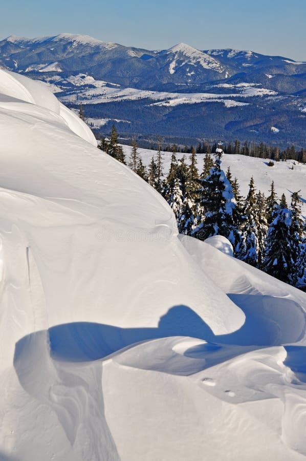 Snowdrifts on a hillside. stock image. Image of frost - 23126501