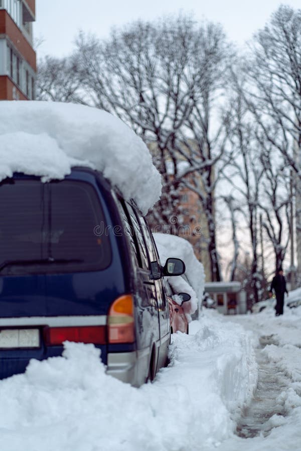 Snowfall in the City. Car Covered in Several Inches of Snow Stock Image ...