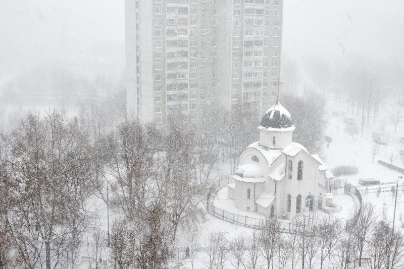Snowfall in city stock image. Image of snowstorm, houses - 48416207
