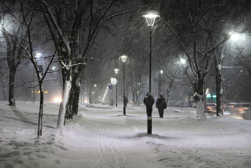 Snowfall in the night city stock image. Image of snow - 263747025