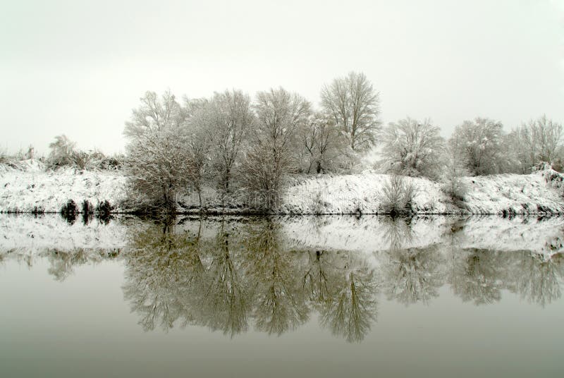 Snowfall on the river stock photo. Image of glacier - 106204810