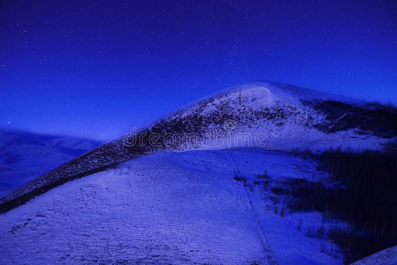 Snowfield in night sky stock photo. Image of night, snow - 52462222