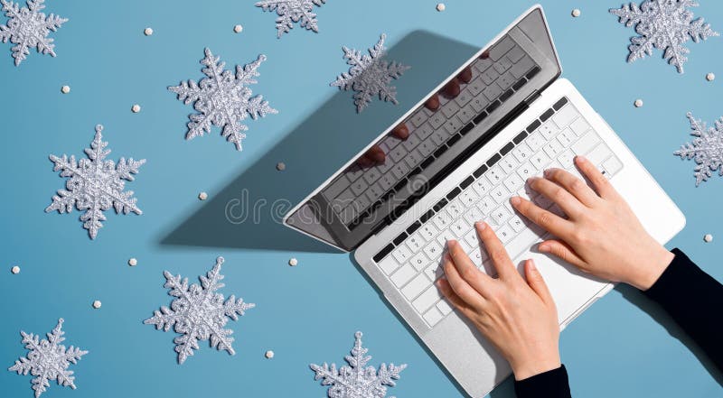 Snowflakes with Person Using a Laptop Computer Stock Photo - Image of ...