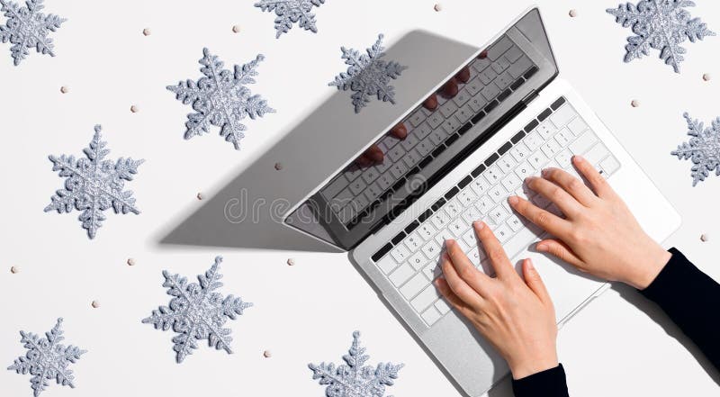 Snowflakes with Person Using a Laptop Computer Stock Image - Image of ...