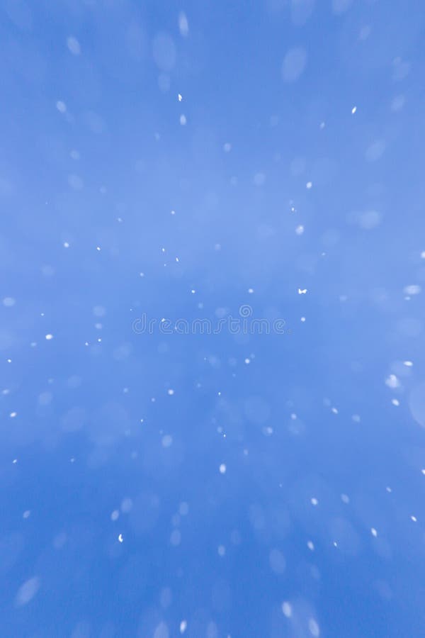 Snowing on a blue sky stock photo. Image of hoarfrost - 109462796
