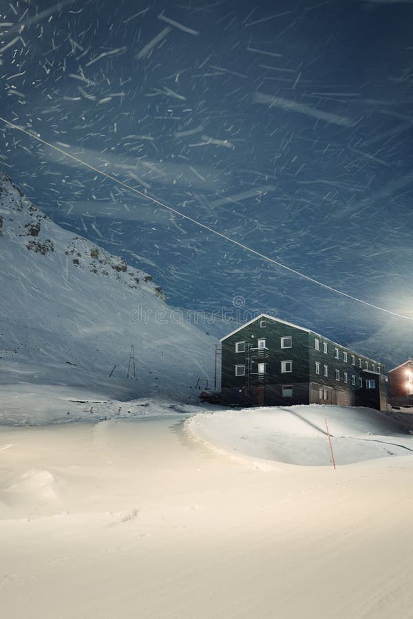 Snowing on Green Cabin Under Mountain in Longyearbyen, Svalbard Stock ...
