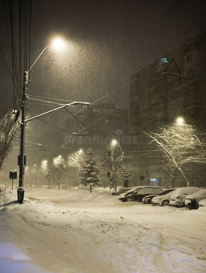 Snowing in a sleepy town stock photo. Image of city, snow - 34646120