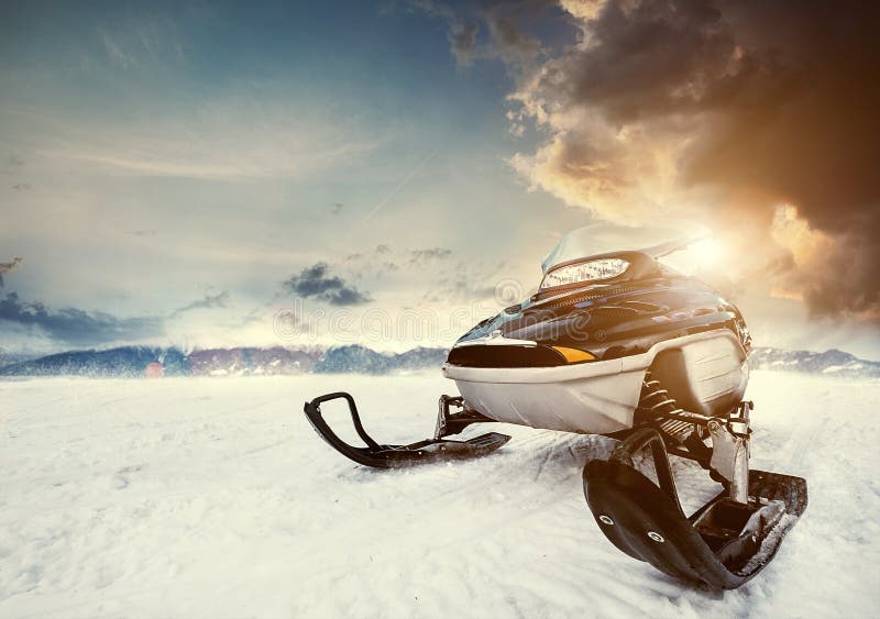 Snowmachine on the Mountain Lake Frozen Surface with Thunderstorm ...