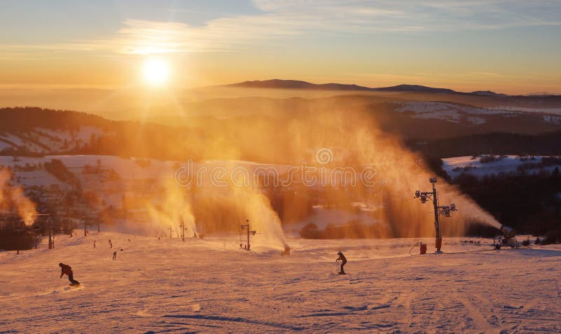 Snowmaker Producing Snow in a Ski Resort. Snowjet in Side Light and ...
