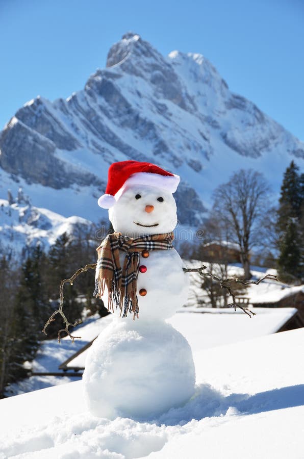 Snowman in Alps Mountains. Snow Man Building Fun in Winter Mountain ...