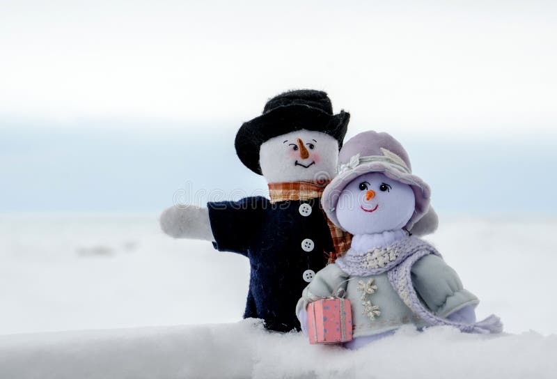 Snowman Couple Pose in the Snow Stock Image - Image of america ...