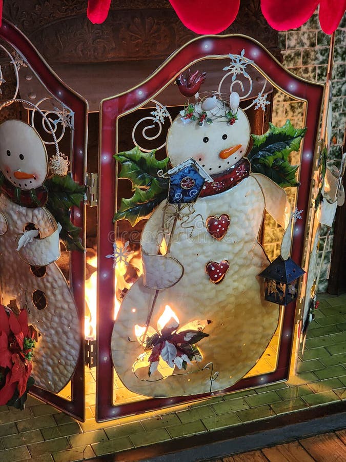 Snowman by fireplace stock photo. Image of christmas - 264606074