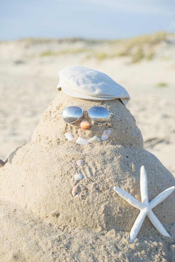 Snowman Made Out of Sand with Hat Stock Photo - Image of beach, season ...