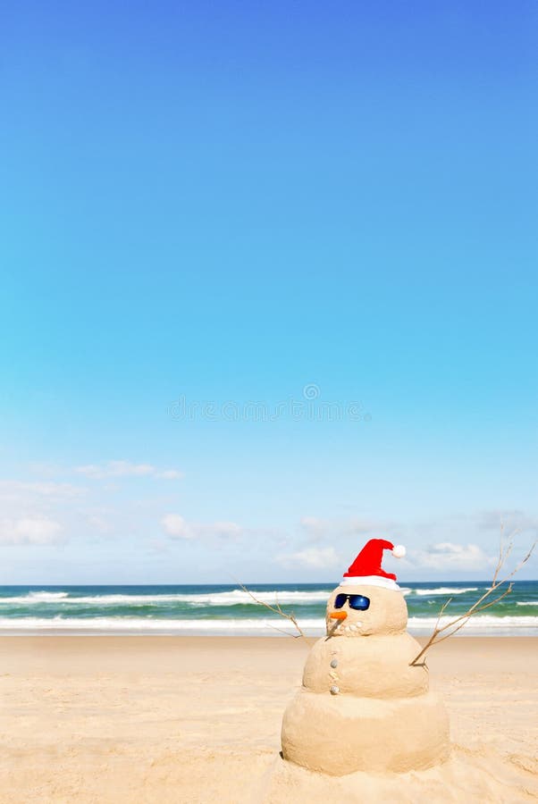 Snowman Made Out of Sand with Santa Hat Stock Image - Image of ...