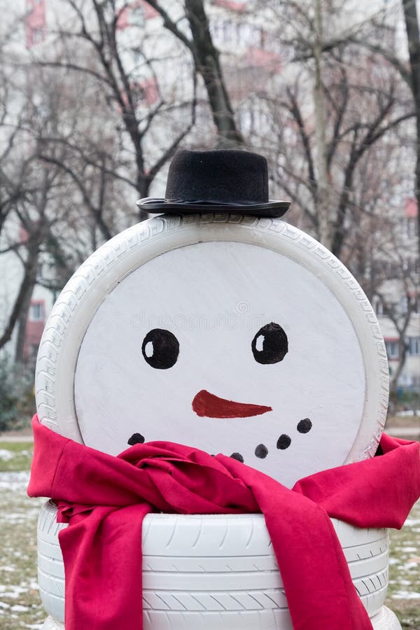 Snowman made by tire car. stock image. Image of white - 82681065