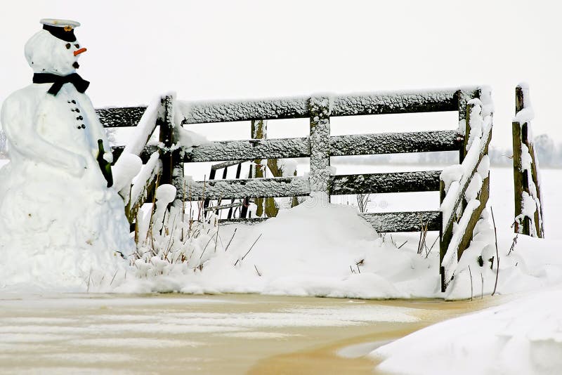 Snowman near fence stock photo. Image of wintry, winter - 3397596