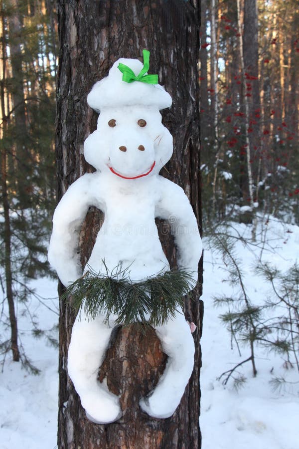 Snowman on a Pine in the Form of a Monkey Stock Photo - Image of ...