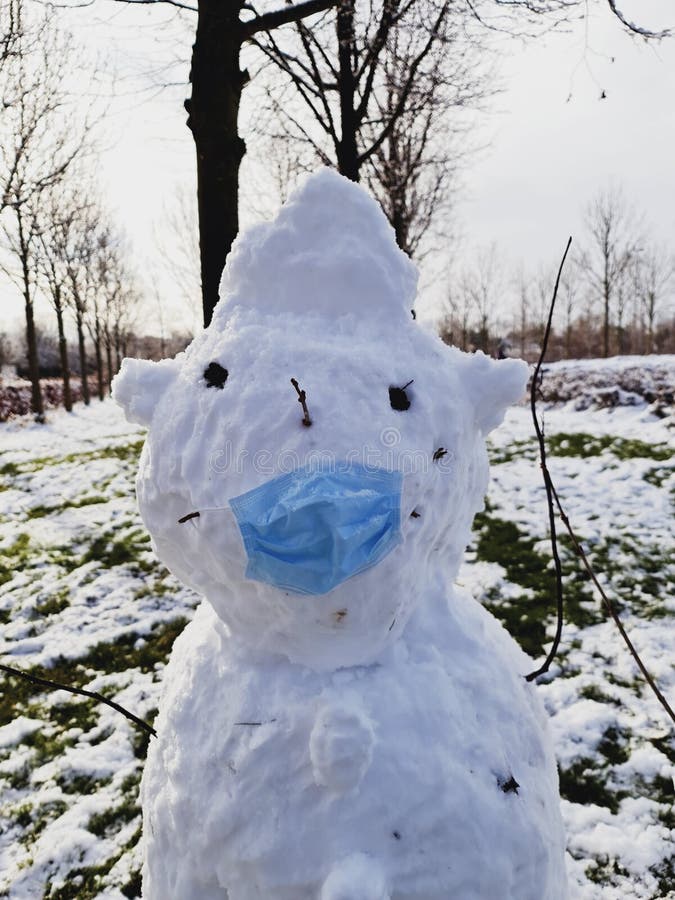 Snowman Wearing a Mask for Protection Against Covid Stock Photo - Image ...