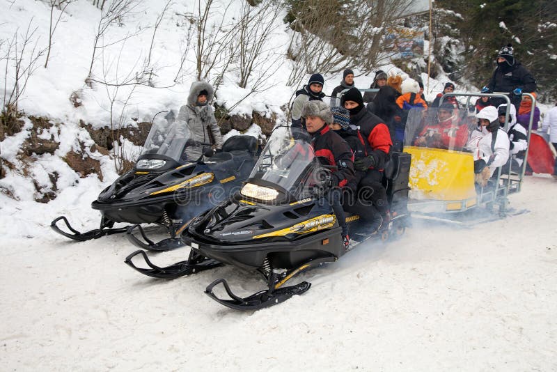 Snowmobile Sled Pulling Offers Fun for Kids in Cold Weather Editorial ...