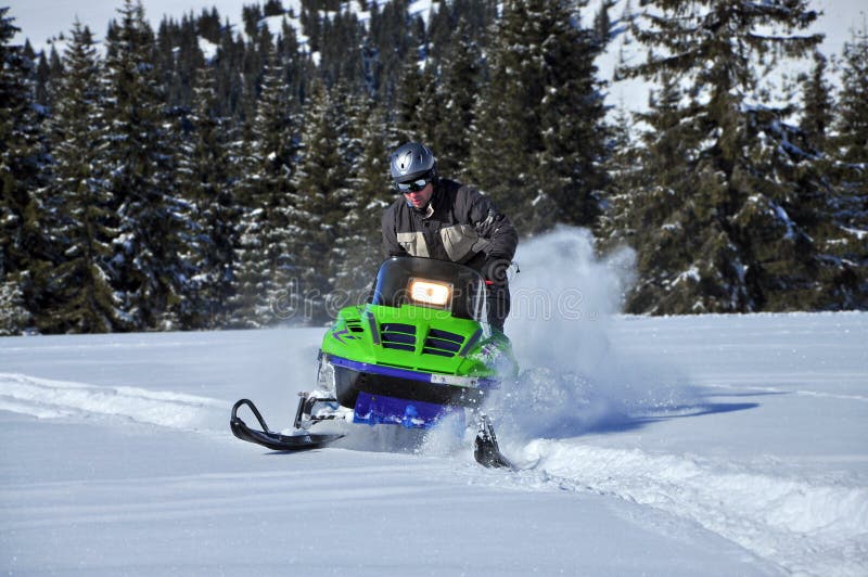 Snowmobile in action stock photo. Image of adventure - 20484154