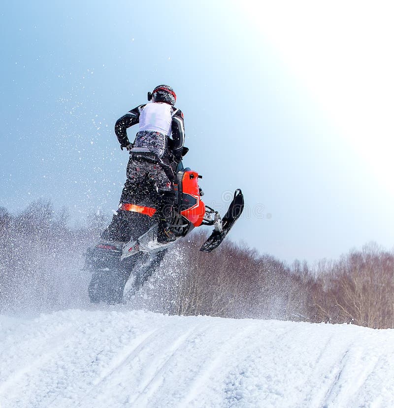 Snowmobile in High Jump Above Track Stock Photo - Image of machine ...