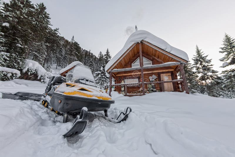 Snowmobile from House Chalets in Winter Forest with Snow in Mountains ...
