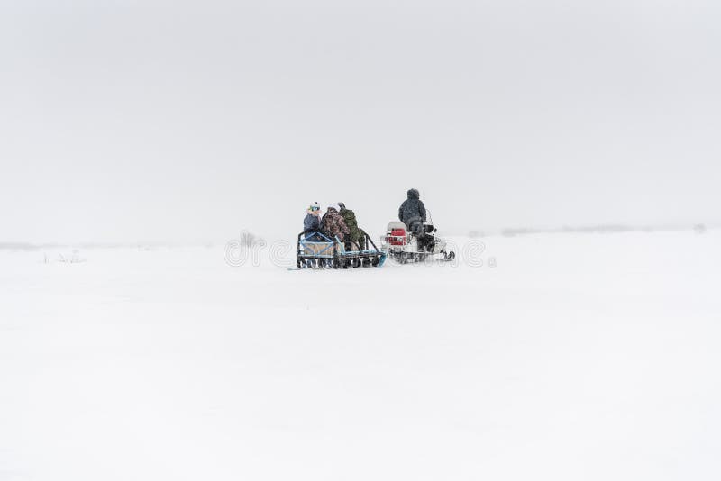 Snowmobile Sled Pulling Offers Fun for Kids in Cold Weather Editorial ...
