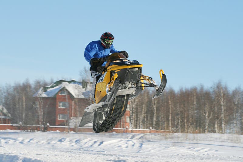 Snowmobile Rider Jumping stock photo. Image of fast, jumping - 4868480