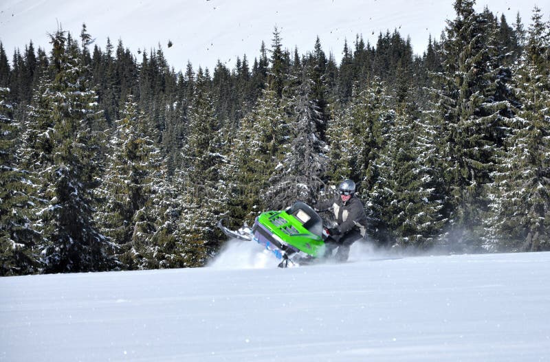 Snowmobile Rider Jumping stock photo. Image of fast, jumping - 4868480