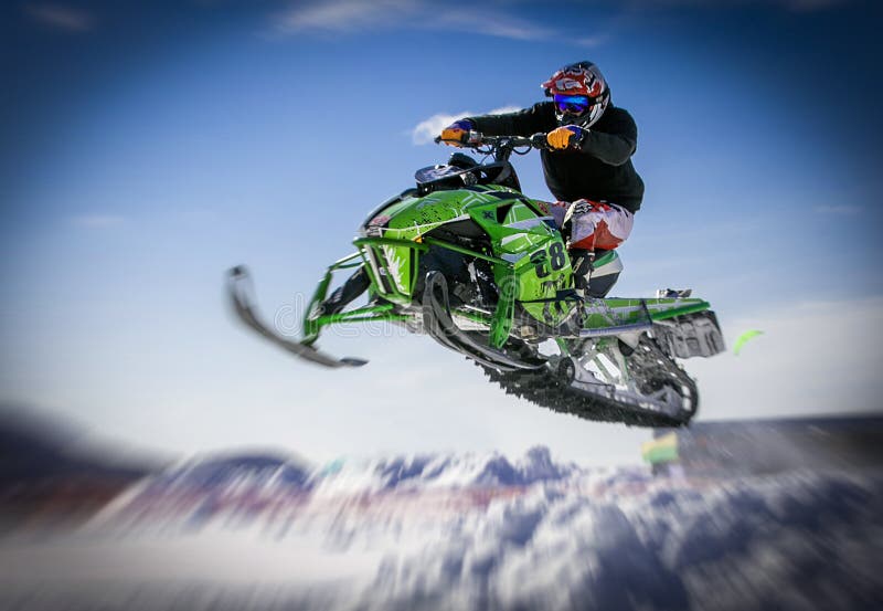 The Snowmobile Rider Jumping through Snow. Close Up Stock Photo - Image ...