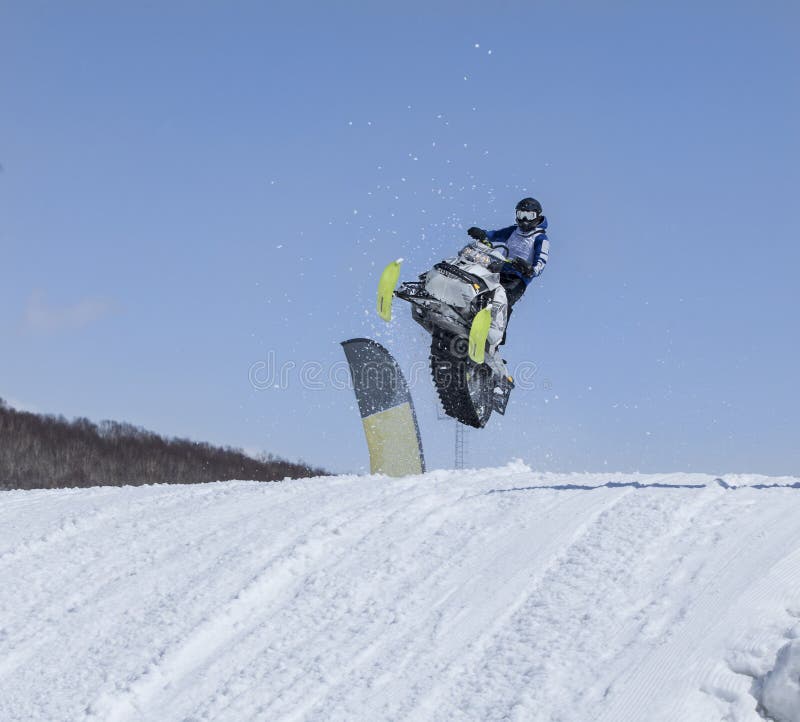 Snowmobile on the Route in a Jump in Air Stock Photo - Image of ...