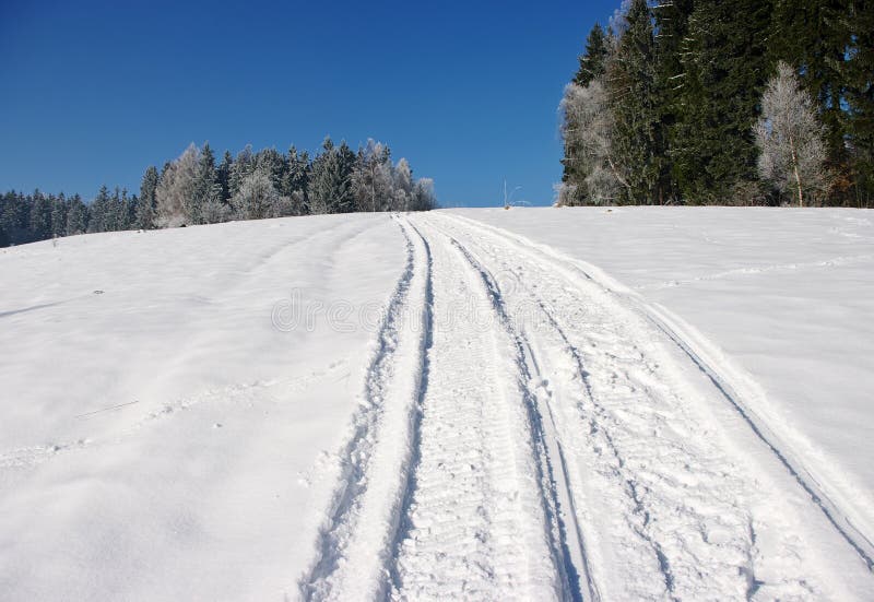 Snowmobile Track Mark on the Snow with the Sunset in the Sky Stock ...