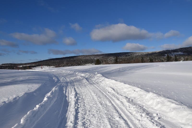 A Snowmobile Track in a Field Stock Photo - Image of freezing, winter ...