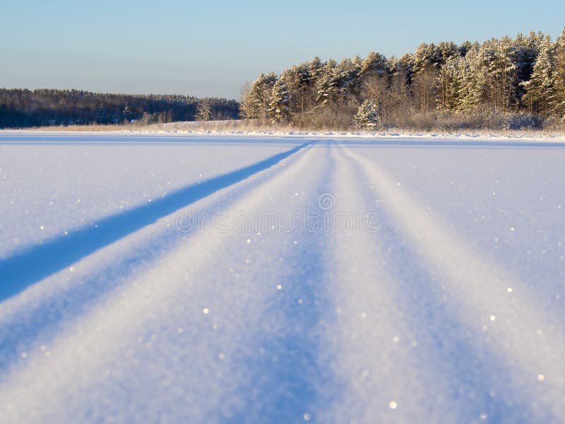 Snowmobile Track Mark on the Snow with the Sunset in the Sky Stock ...