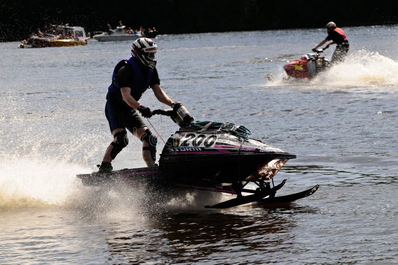 Snowmobile on water editorial photography. Image of enjoy - 10850002