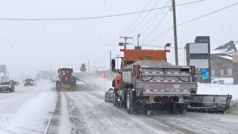 Snowplows Clear Snow from Streets during a Snow Storm Stock Image ...