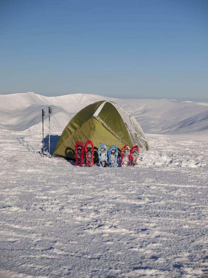 Snowshoes and Tent on Snow in the Mountains. Stock Photo - Image of ...