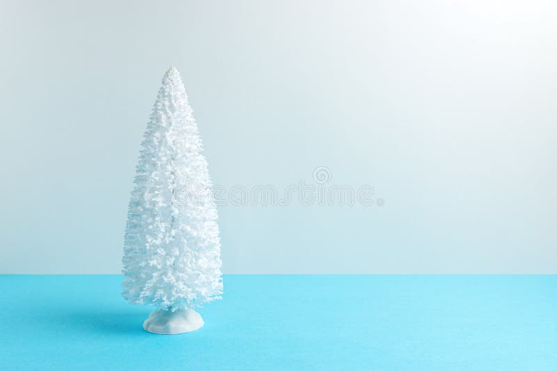 Snowy Christmas Tree on Blue Table. Christmas or New Year Minimal ...