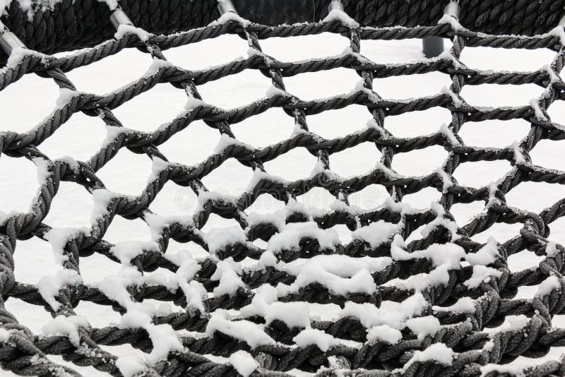 Snowy Circular Net of a Rope Swing Stock Image - Image of rope, iced ...