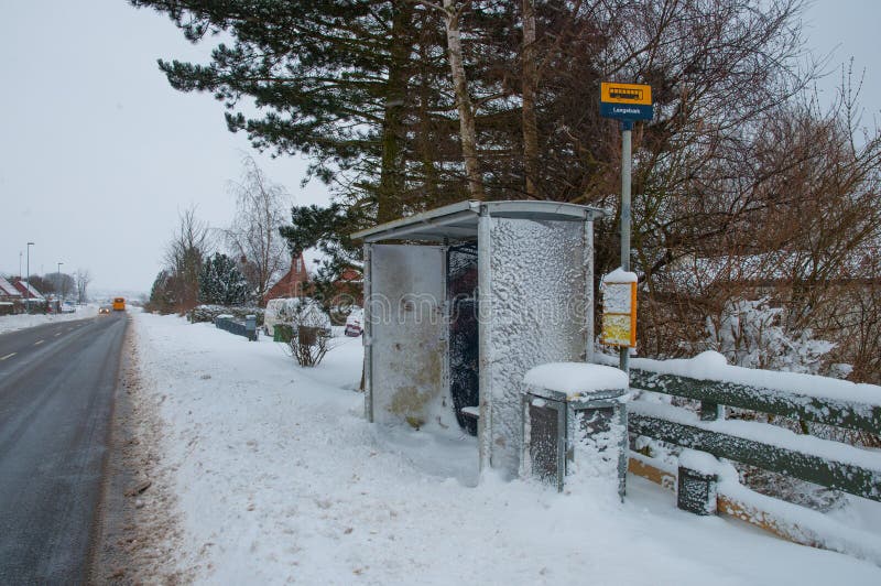 Bus stop on a snowy day stock image. Image of traditional - 111340999