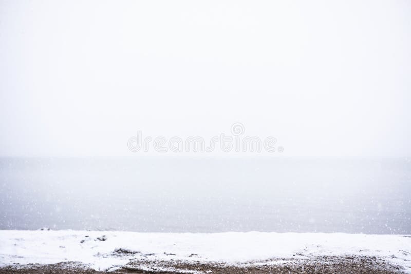 Snowy day by the sea stock photo. Image of coastline - 306231638