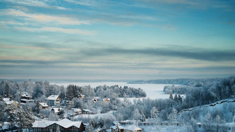 Snowy Forest and Cottages and Iced Lake at Sunset Stock Image - Image ...