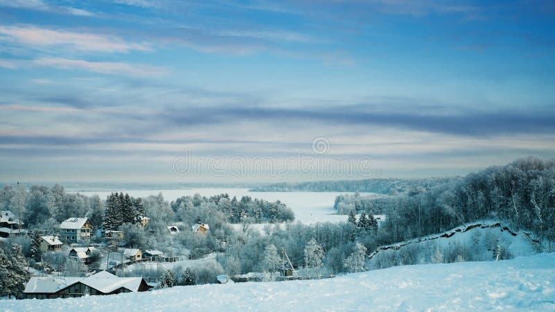 Snowy Forest and Cottages and Iced Lake at Sunset Stock Photo - Image ...