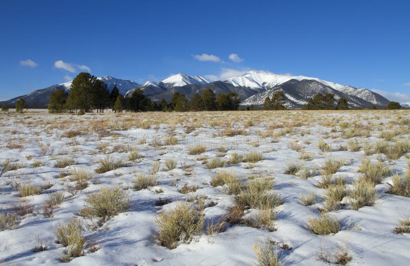 Snowy Meadow with Mountain Background Stock Image - Image of blue ...