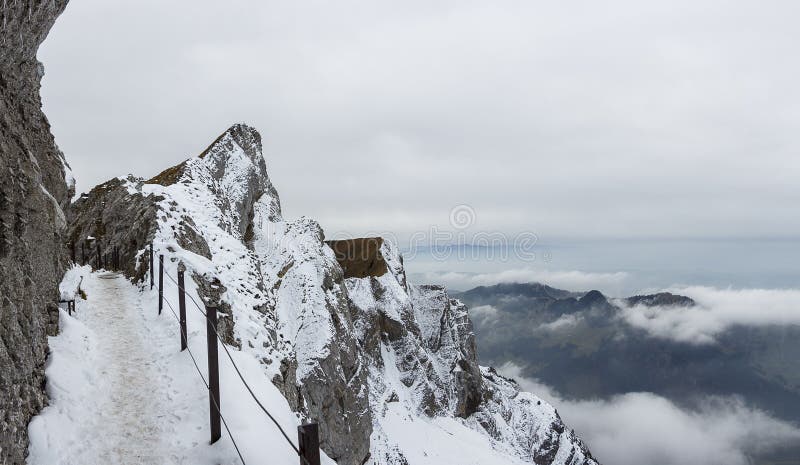 Snowy Mountain Path stock photo. Image of rocks, swiss - 61825214