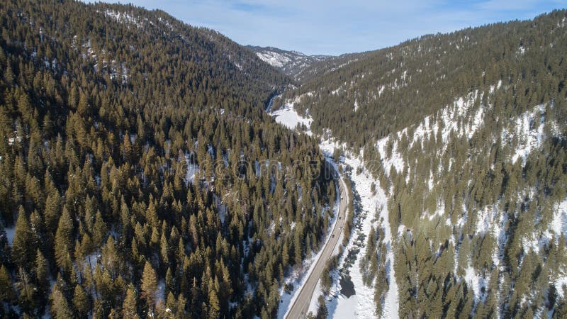 A Snowy Mountain Range with a Road Running through it Stock Image ...