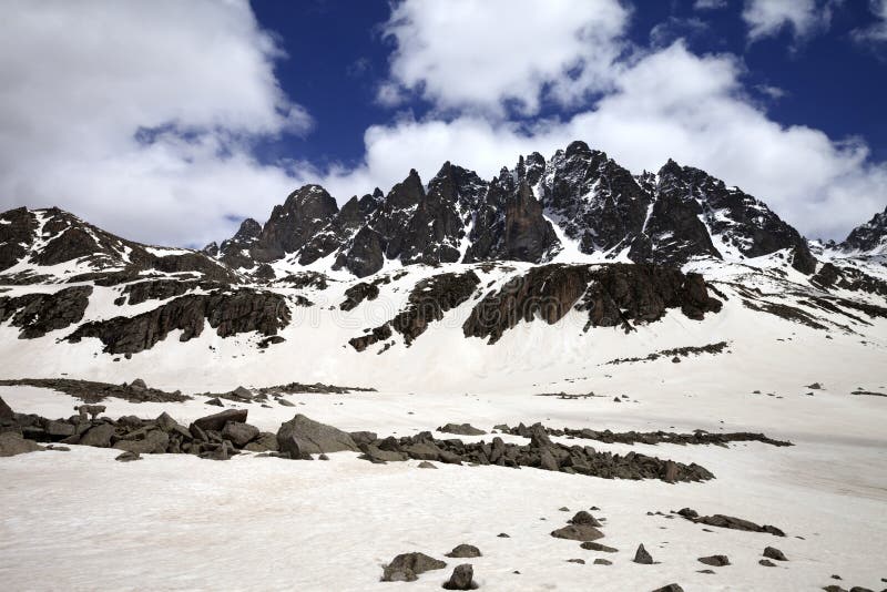 Snowy mountain at wind day stock photo. Image of clouds - 77678624