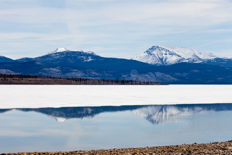 Snowy Mountains Mirrored on Lake Laberge, Yukon Stock Image - Image of ...